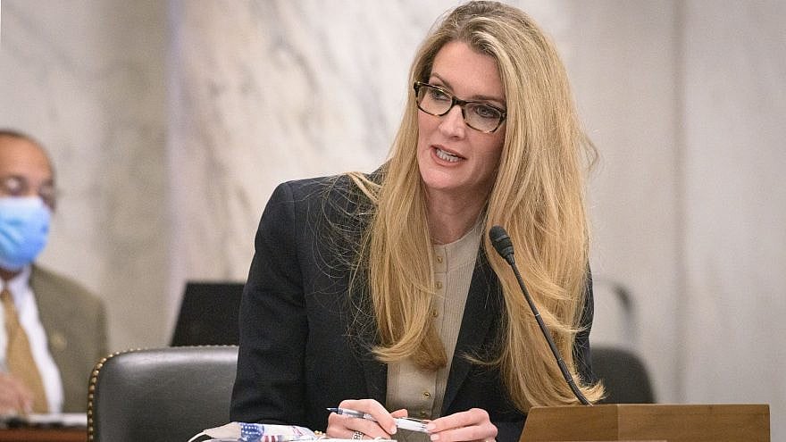 Loeffler disavows former neo-Nazi leader after posing with him for ...