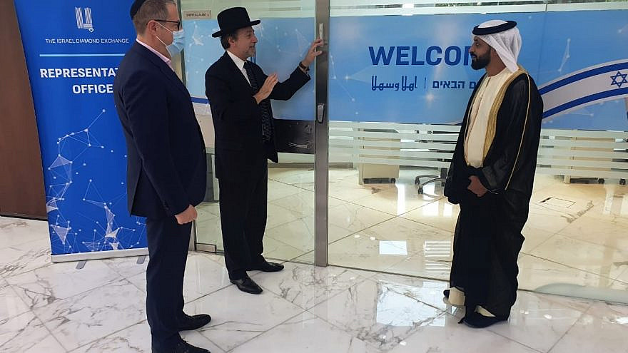 Rabbi, cantor hang mezuzah at Israel Diamond Exchange office in Dubai ...