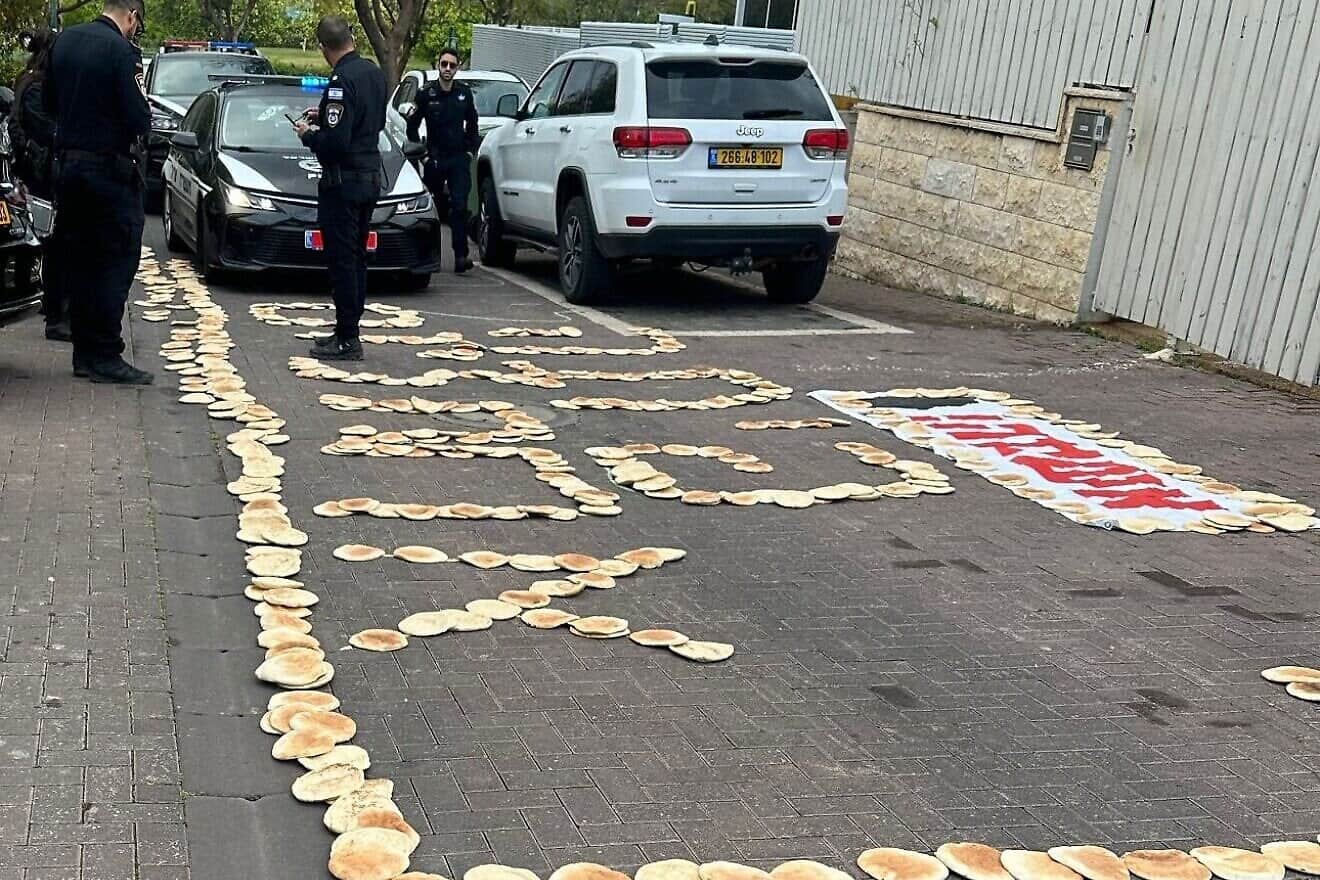 Anti-gov’t protesters scatter bread outside minister’s home on Passover ...